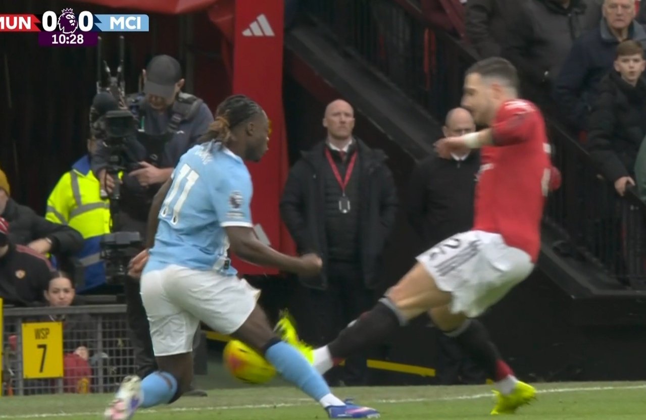 Dalot escapes red card after heavy challenge on Doku in Manchester derby